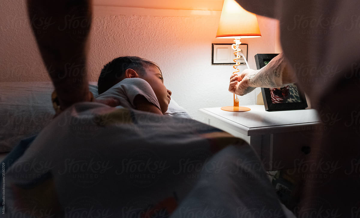 "Father Turning Off Light For Son" by Stocksy Contributor "Milles Team ...