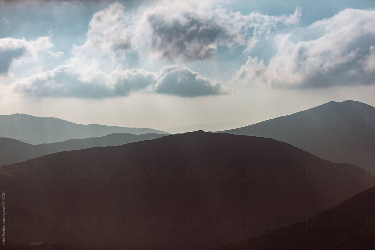 "Landscape With Sunset Clouds Between Mountains." by Stocksy ...