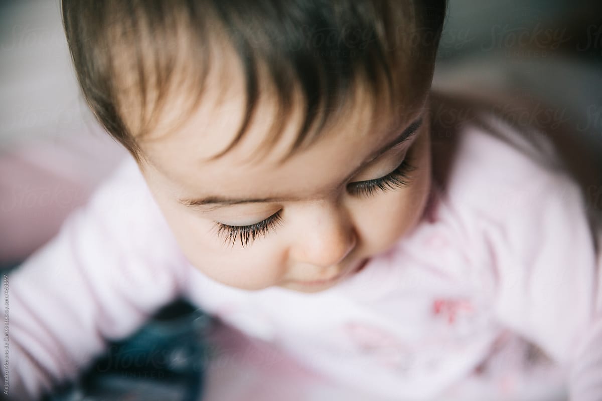 "Baby Girl Closeup Portrait Looking Down" by Stocksy Contributor ...