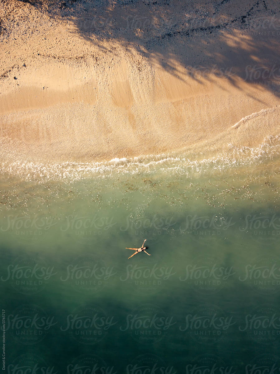 "Aerial View Of Girl Floating In The Ocean Like A Star Fish" by Stocksy ...