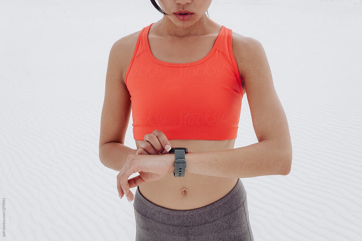 "Fitness Model Breathing Heavily Checking The Time On Her Watch" by ...