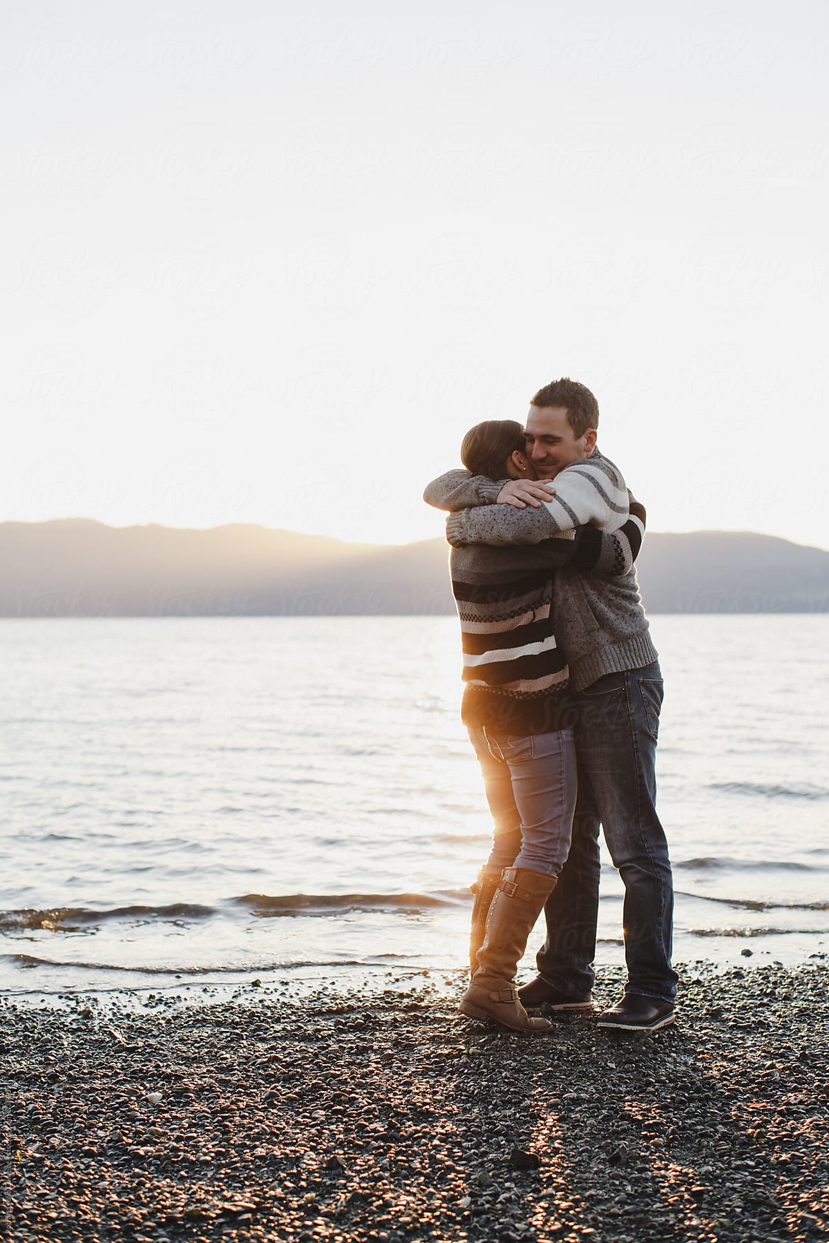 "Young Happy Couple Enjoying Being Together At The Beach At Sunset" by ...