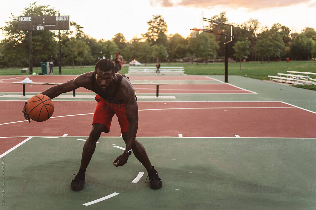 "An Attractive Young Black Man Playing Basketball O On A Sunny Day" by ...