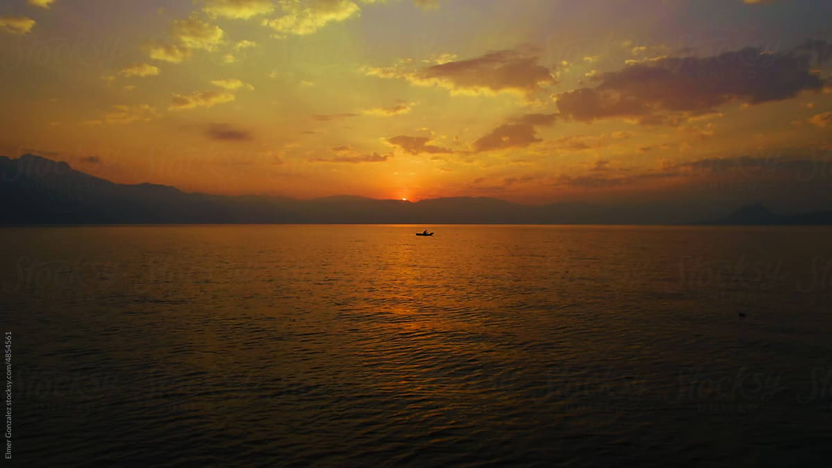 "Sunrise And Sunset Over The Lake" by Stocksy Contributor "Elmer ...