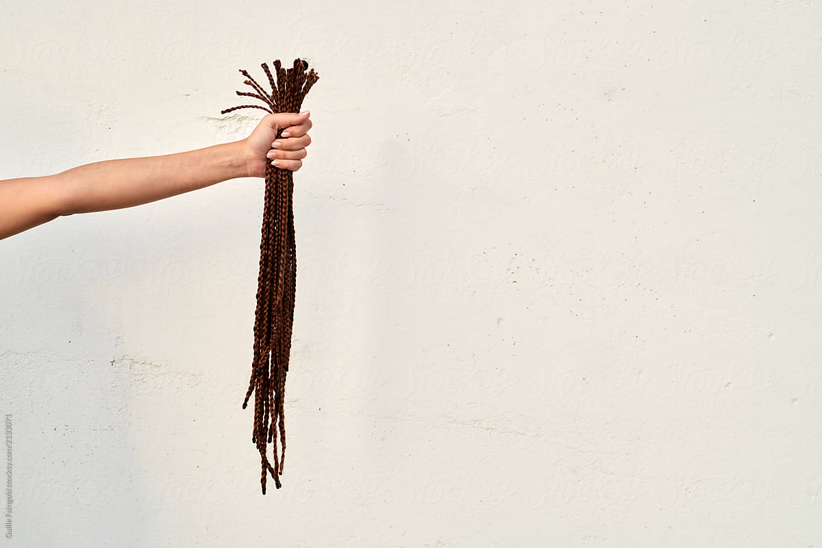 "Woman's Arm With Cut Hair Over Wall." by Stocksy Contributor "Guille ...