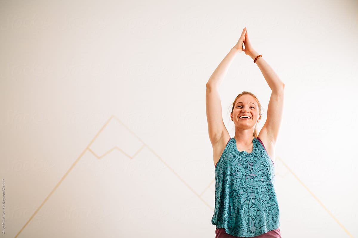 "Smiling Woman In Yoga Pose" by Stocksy Contributor "Abby Mortenson ...