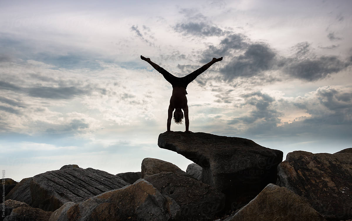 "A Young Man Performing A Balancing Act On The Seashore." by Stocksy ...