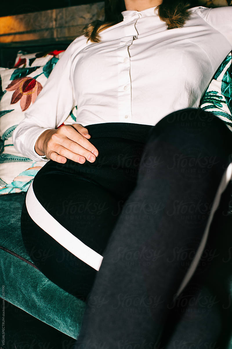 "Closeup Of Fashionable Female Model Reclining On Green Velvet Sofa" by ...