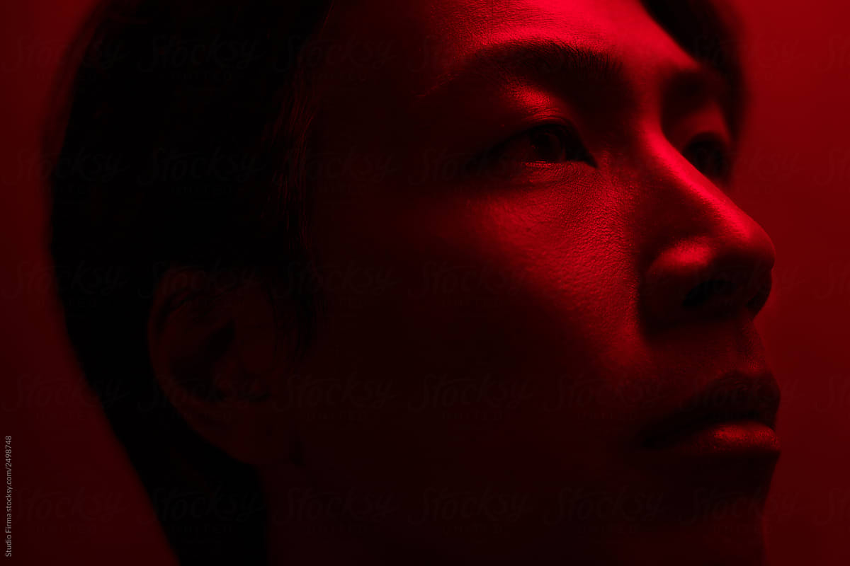 "Red Portrait Of Asian Man" by Stocksy Contributor "Studio Firma" - Stocksy
