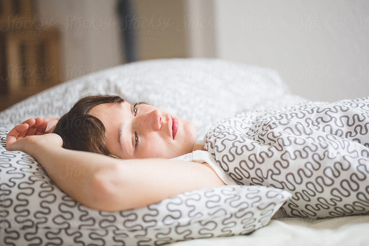 "Young Woman Waking Up In The Morning" by Stocksy Contributor "Michela ...