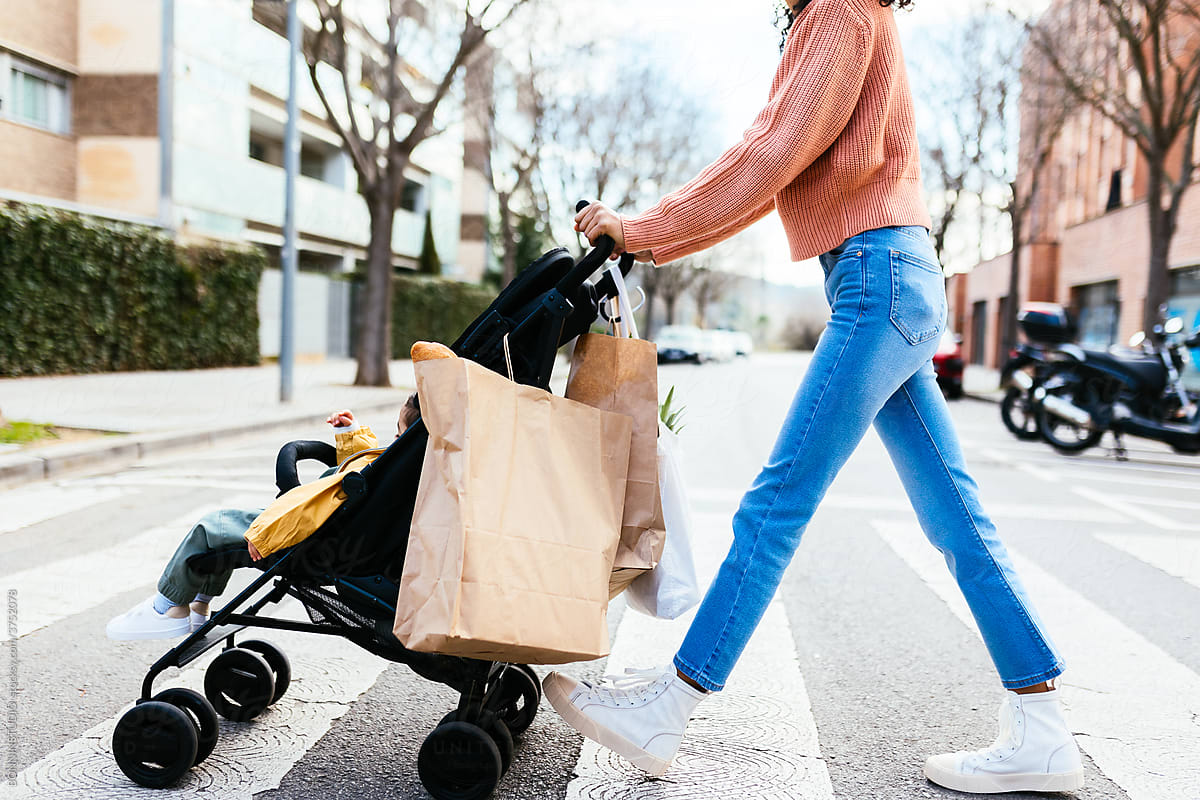 "Crop Woman With Baby Crossing Street" by Stocksy Contributor ...
