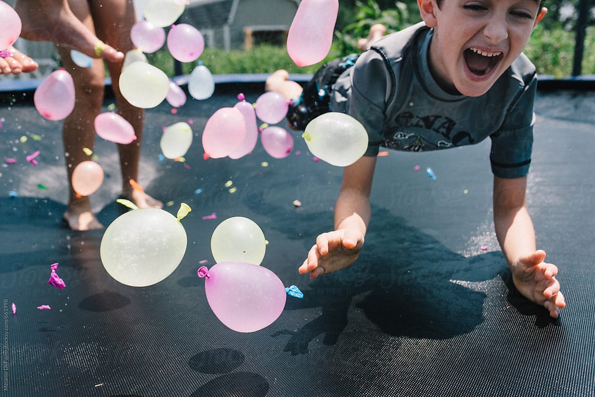 "Bouncing Water Balloons" by Stocksy Contributor "Melanie DeFazio ...