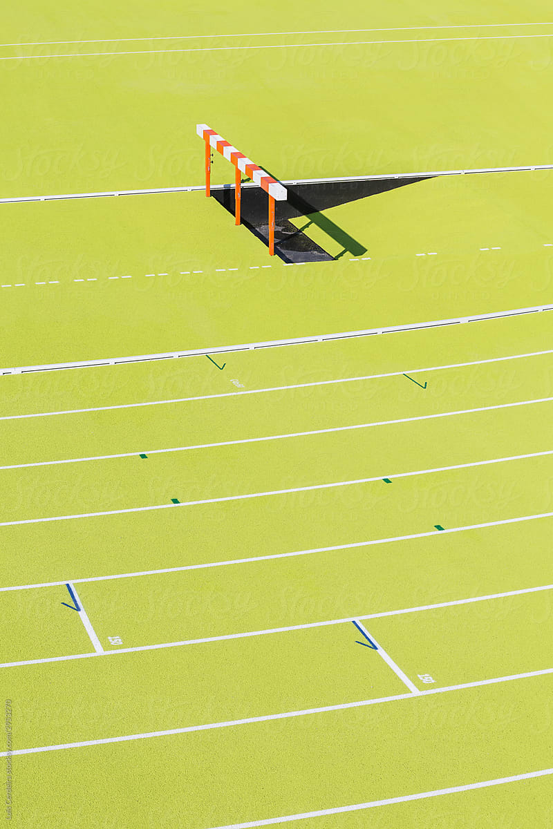 "Athletics Hurdle In A Stadium Field" by Stocksy Contributor "Luis ...