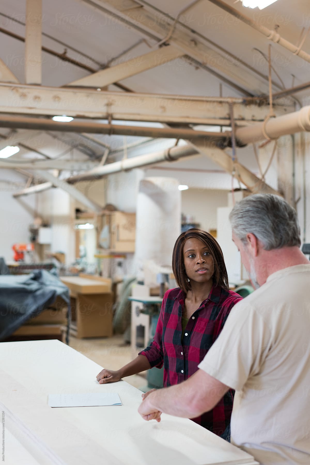 "Carpenter In Wood Shop Instructing Worker" by Stocksy Contributor ...