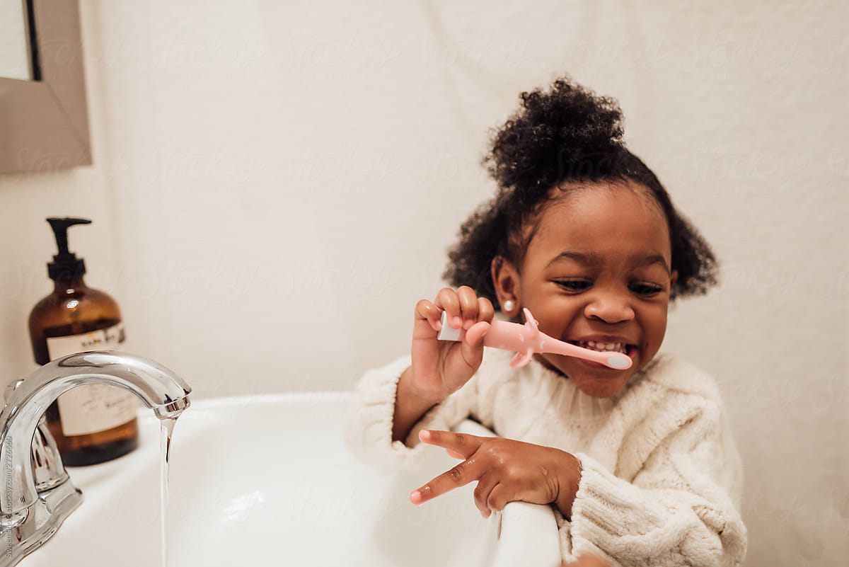 "Young Girl Brushing Teeth With Pink Toothbrush" by Stocksy Contributor ...