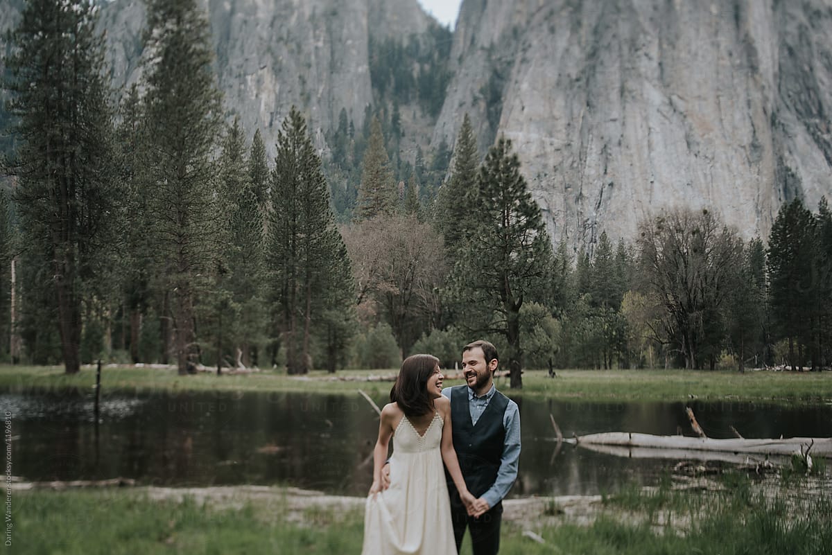 "Bride And Groom Laughing In Front Of Mountain In Yosemite Valley On ...