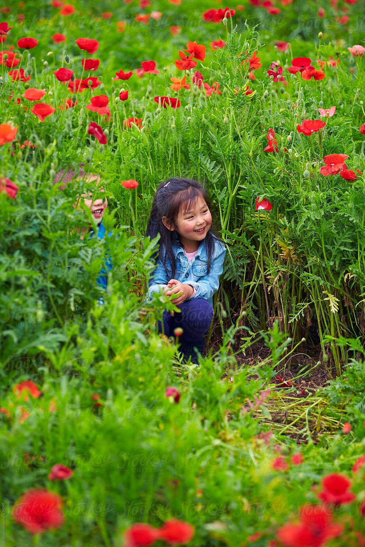 "Happy Kids Playing In The Spring Field" by Stocksy Contributor "Bo Bo ...