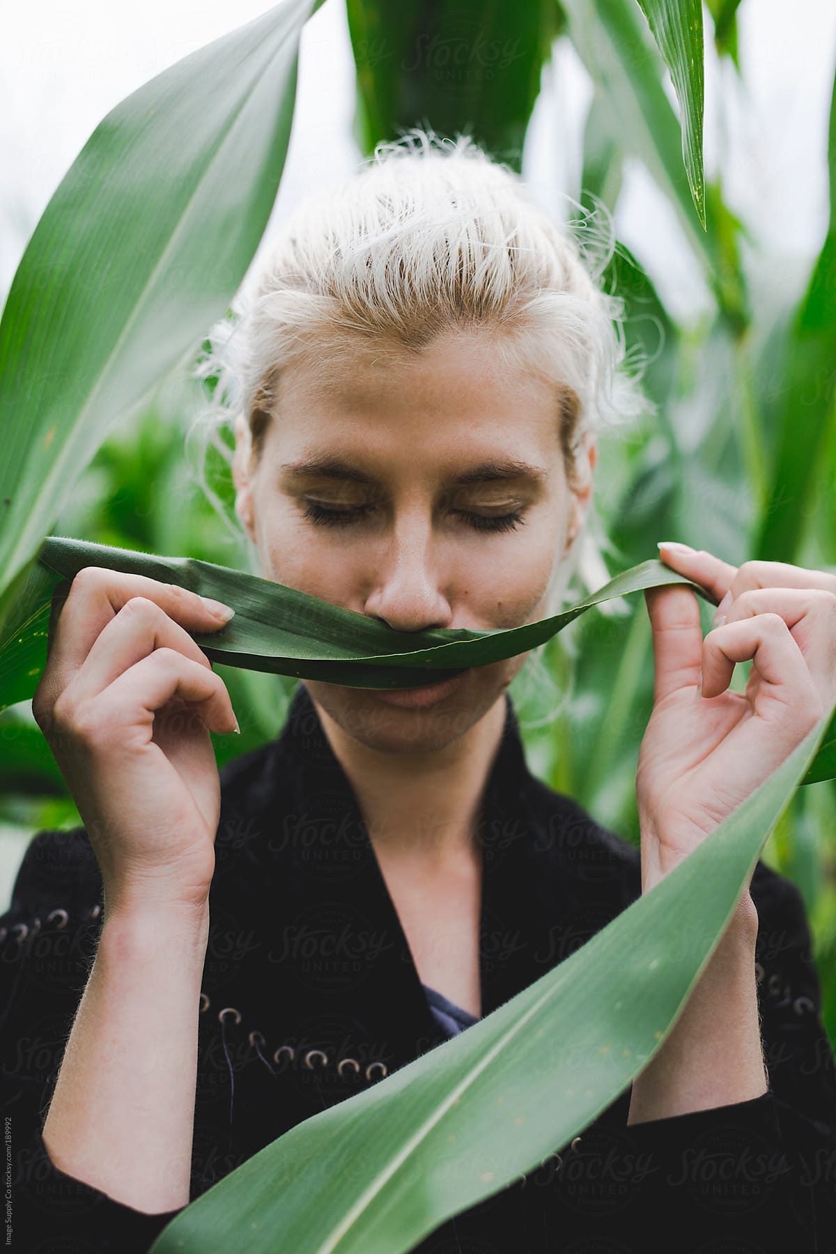 "Girl With Leaf Moustache" by Stocksy Contributor "IMAGE SUPPLY" - Stocksy