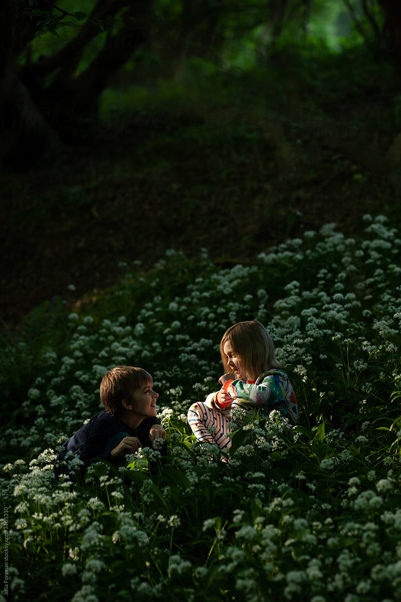 "Two Children Play In A Beautiful Meadow Of Wild Garlic." by Stocksy ...