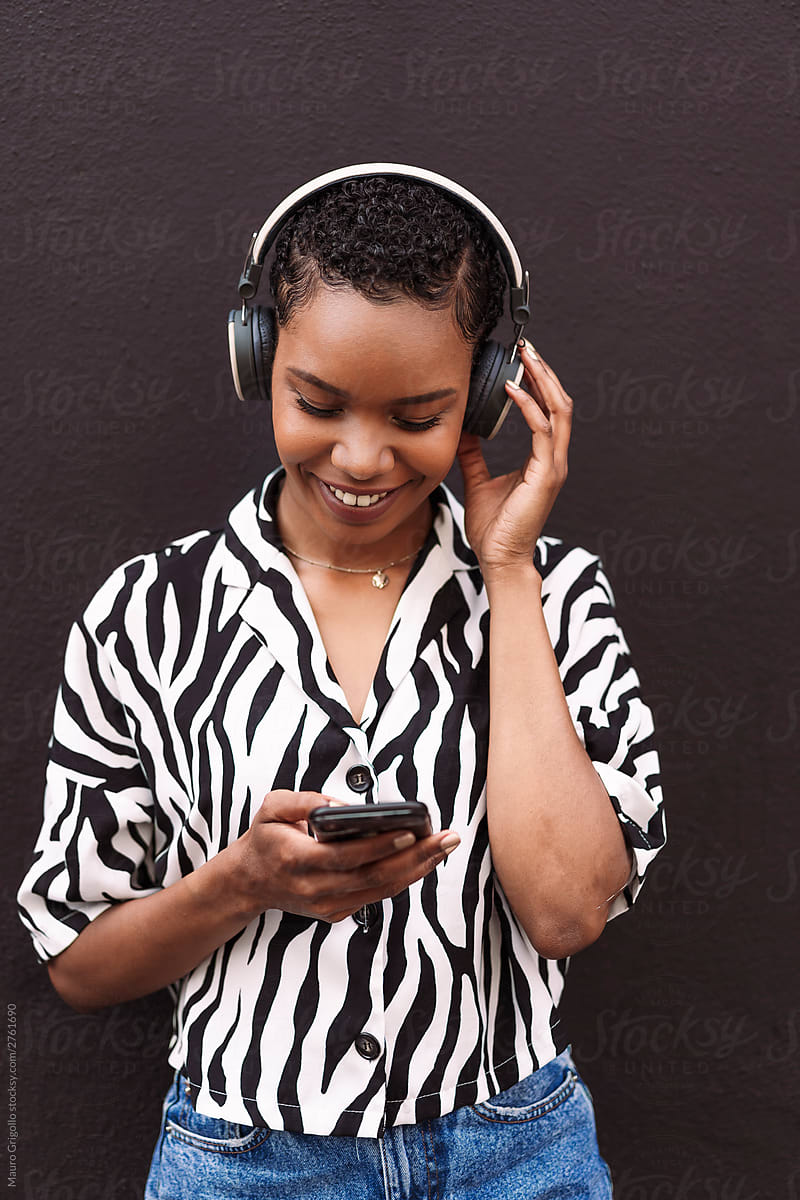 "Black Woman Listening Music From Mobile Phone" by Stocksy Contributor ...
