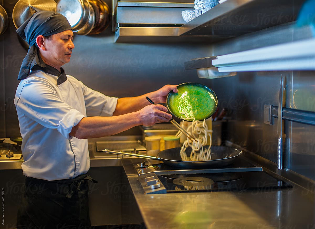 "Chef Cooking In A Japanese Restaurant" by Stocksy Contributor "Mosuno ...