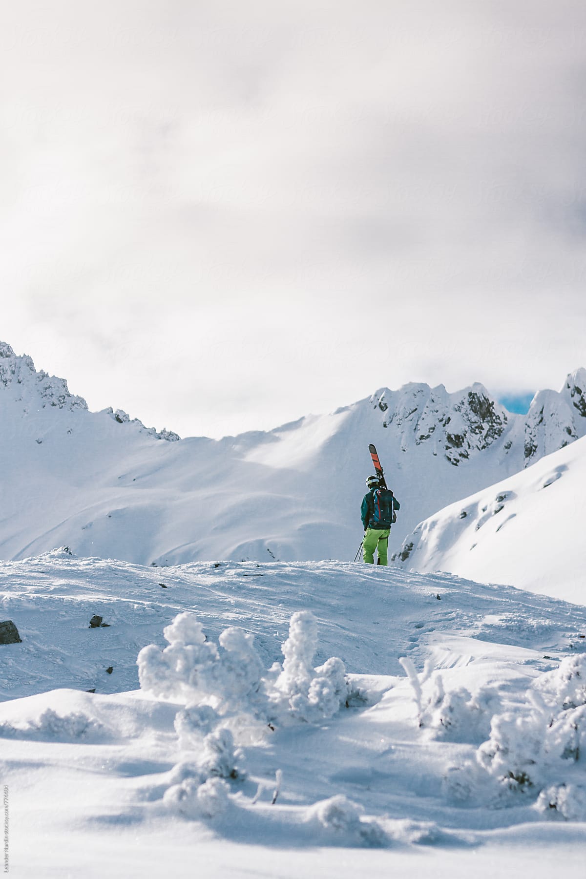 "Male Skier Standing In Snowcovered Alpine Winter Landscape" by Stocksy ...
