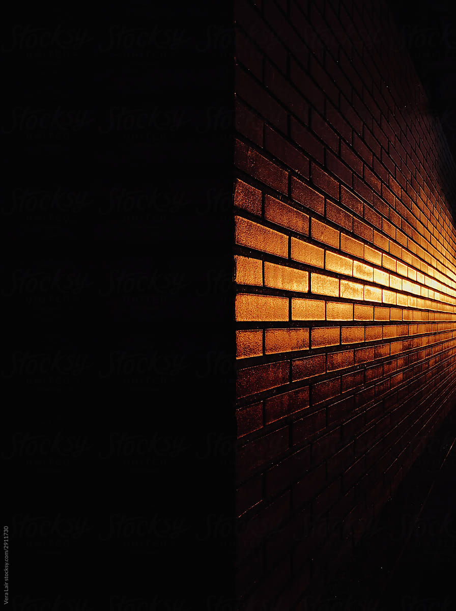 "Brick Wall In The Sunset" by Stocksy Contributor "Vera Lair" - Stocksy
