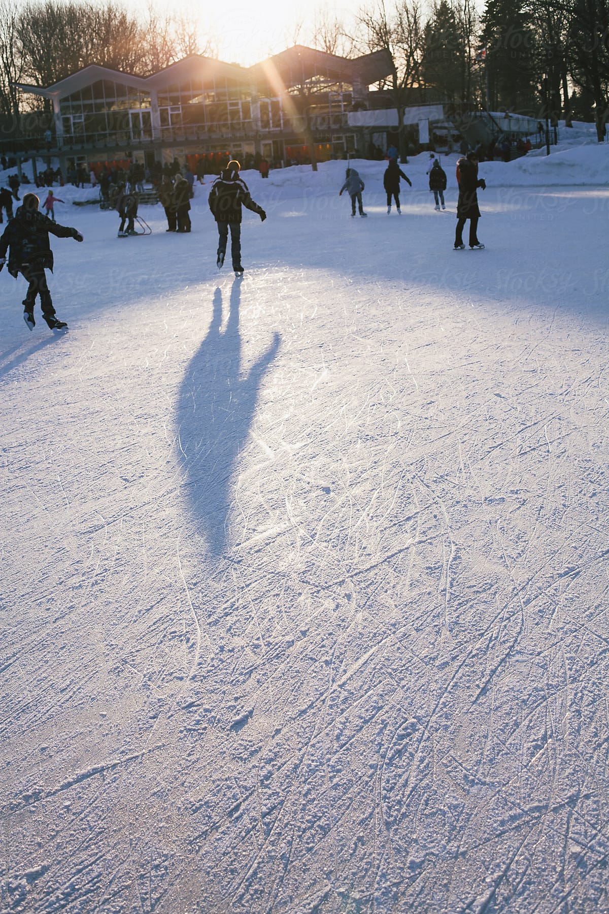 "Shadows Of Skaters On The Ice" by Stocksy Contributor "Erik Naumann ...