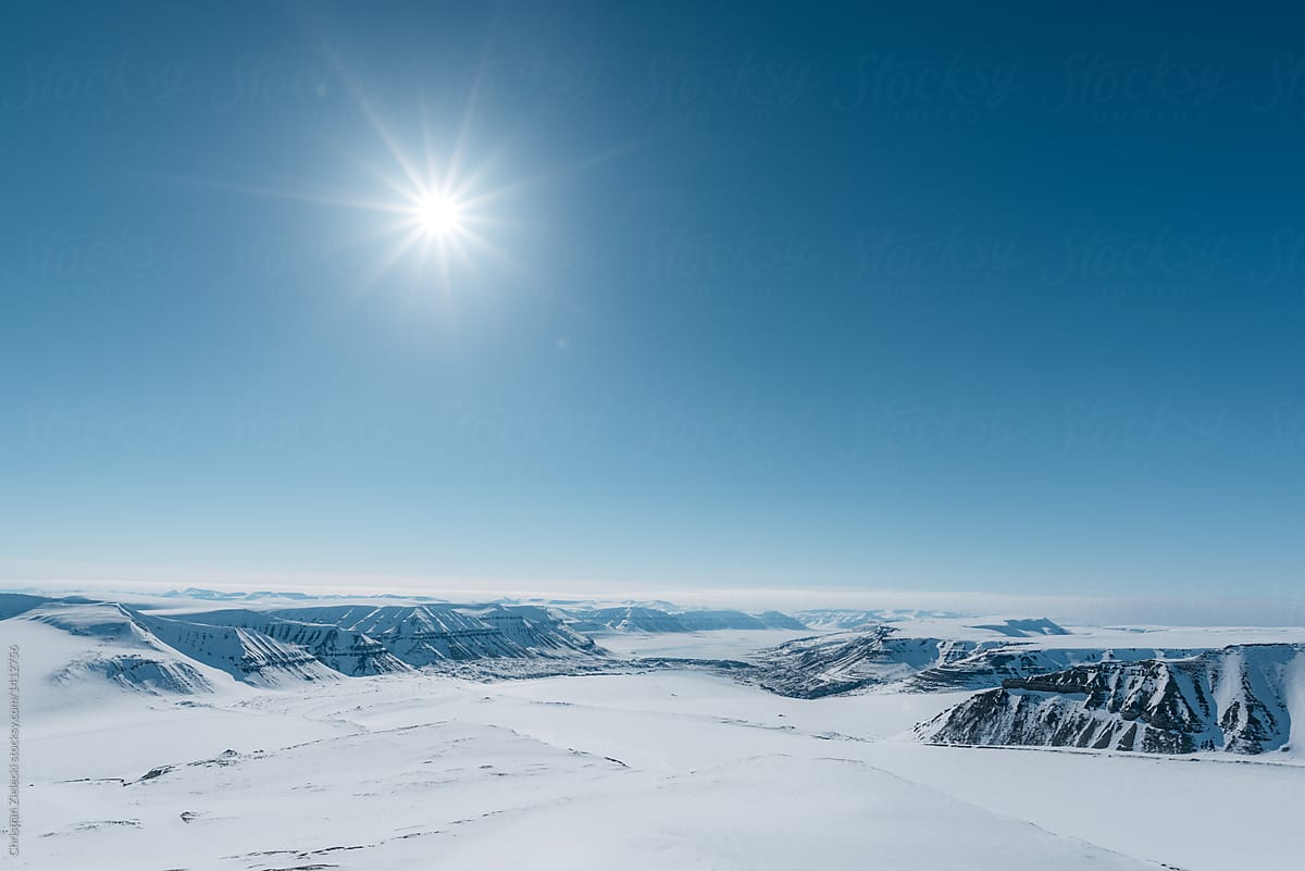 "Bright Sun Over Snowy Mountains" by Stocksy Contributor "Chris ...