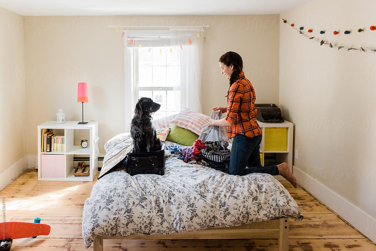 "Teen Packing Her Suitcase With Her Dog" by Stocksy Contributor "Lea ...