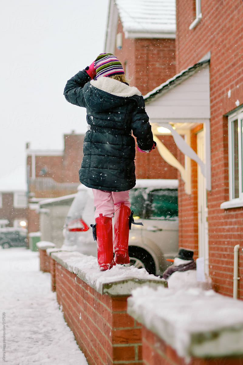 "Children Playing In The Snow At Home" by Stocksy Contributor "Kirsty ...