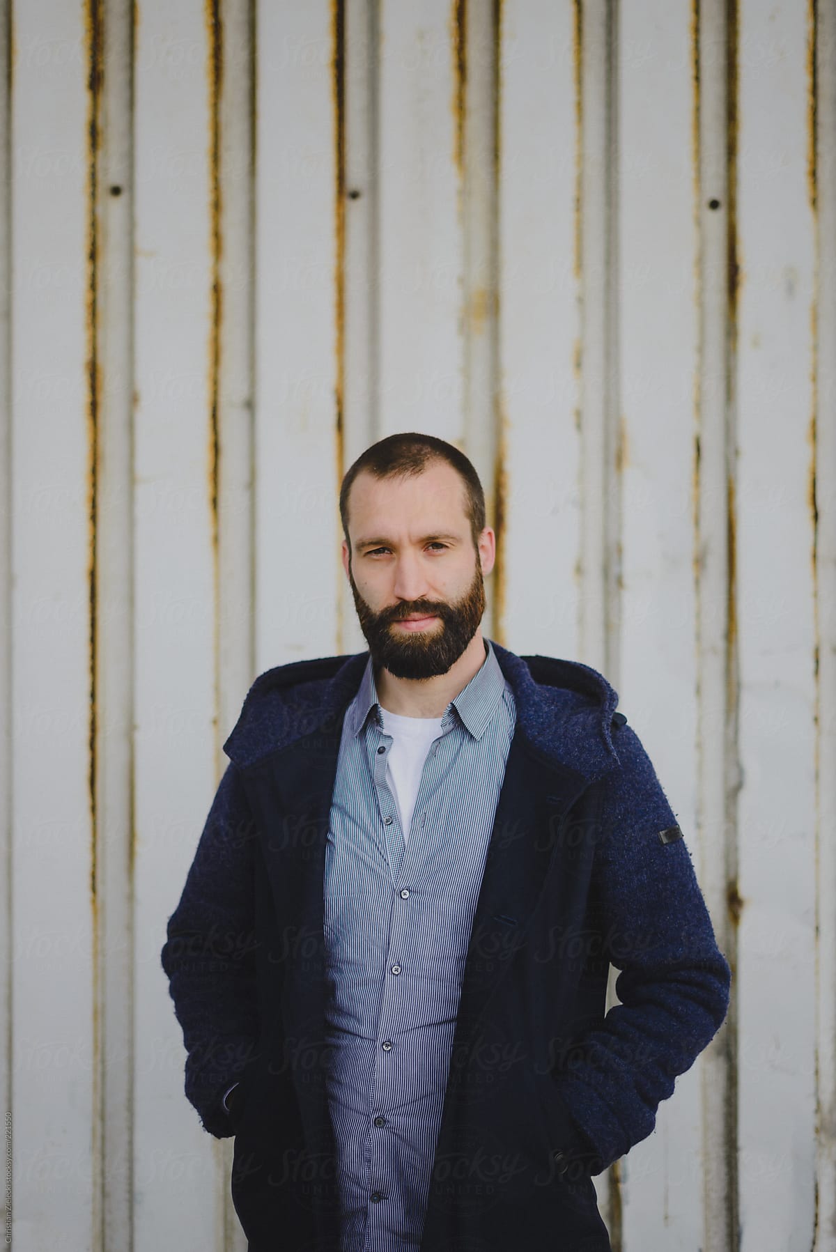 "Bearded Man Standing Near Shabby Wall" by Stocksy Contributor "Chris ...