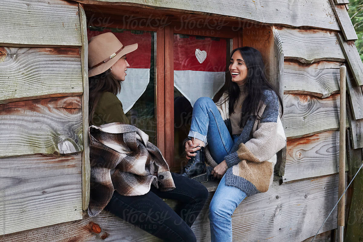 "Friends Talking At A Cabin In A Forest" by Stocksy Contributor "Ivan ...