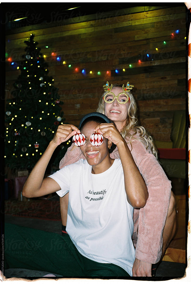 "User Generated Content Merry Multiracial Women With Baubles Hugging ...