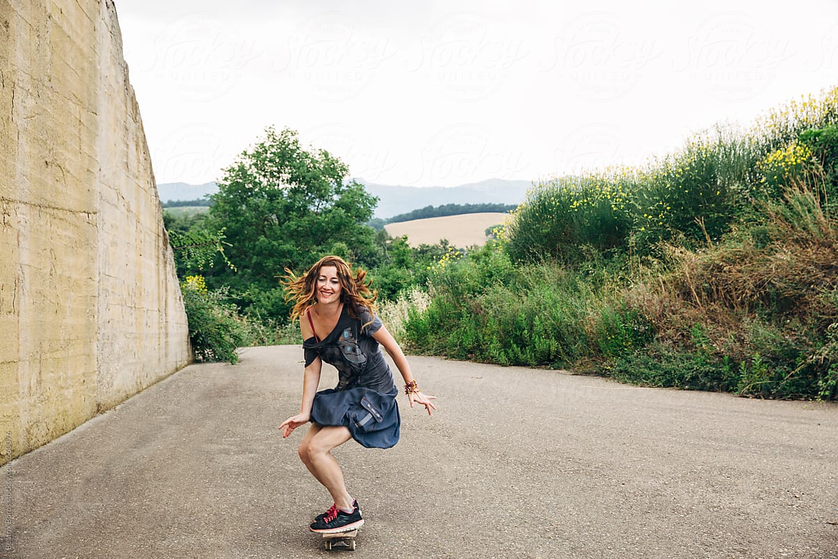 "Happy Skateboarder Woman Skateboarding In The Countryside" by Stocksy ...