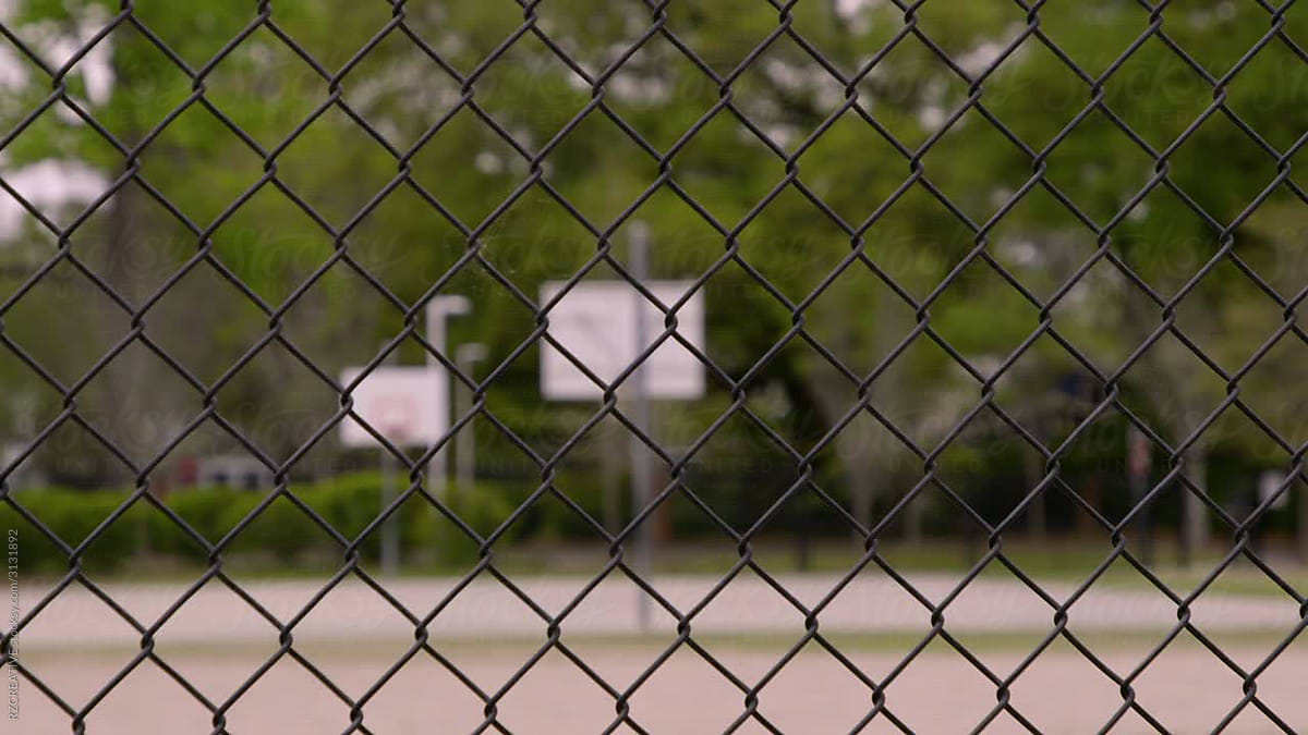 "Empty Basketball Court Through A Gated Fence." by Stocksy Contributor ...