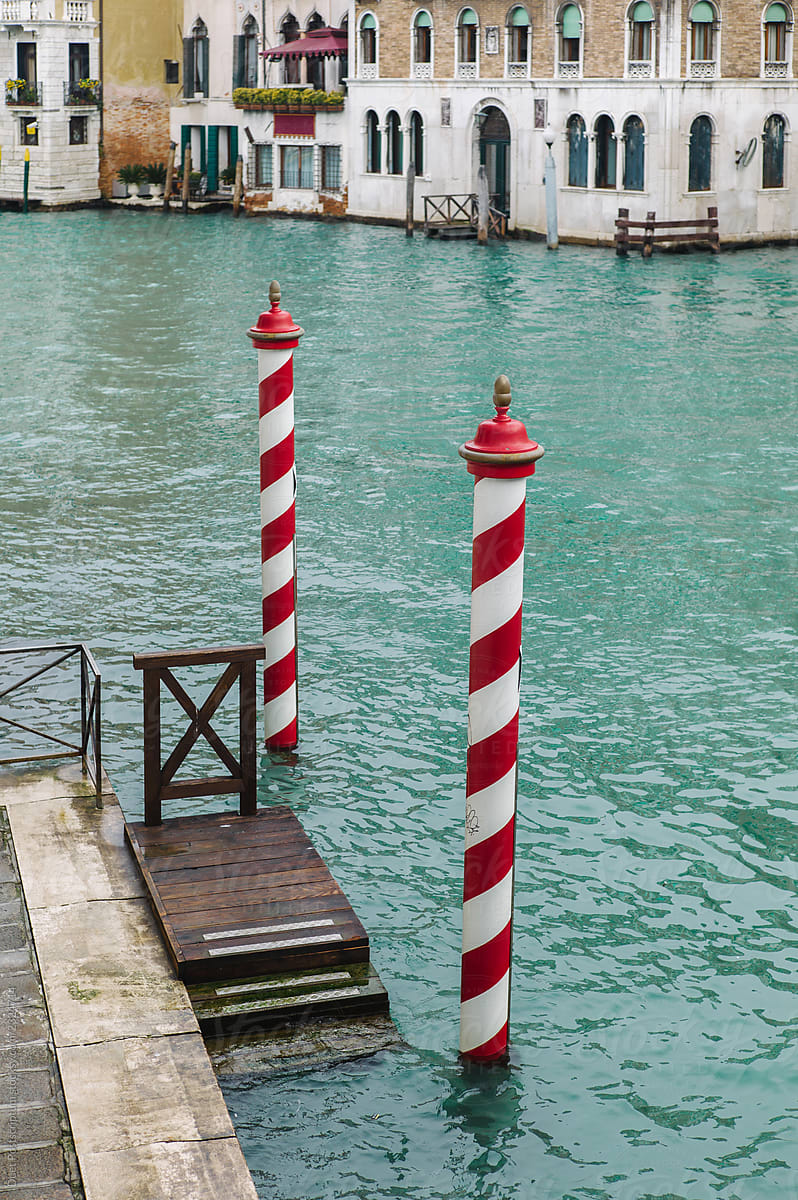 "Striped Poles Near Small Pier" by Stocksy Contributor "Duet ...