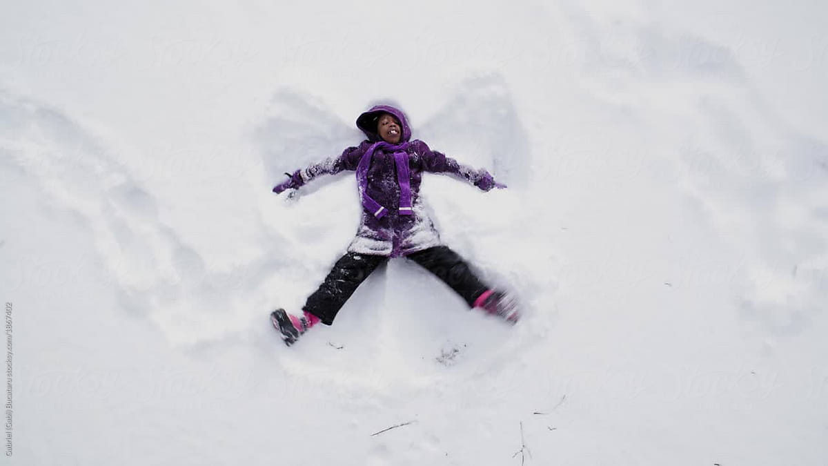 "African American Girl Doing A Snow Angel" by Stocksy Contributor "Gabi ...