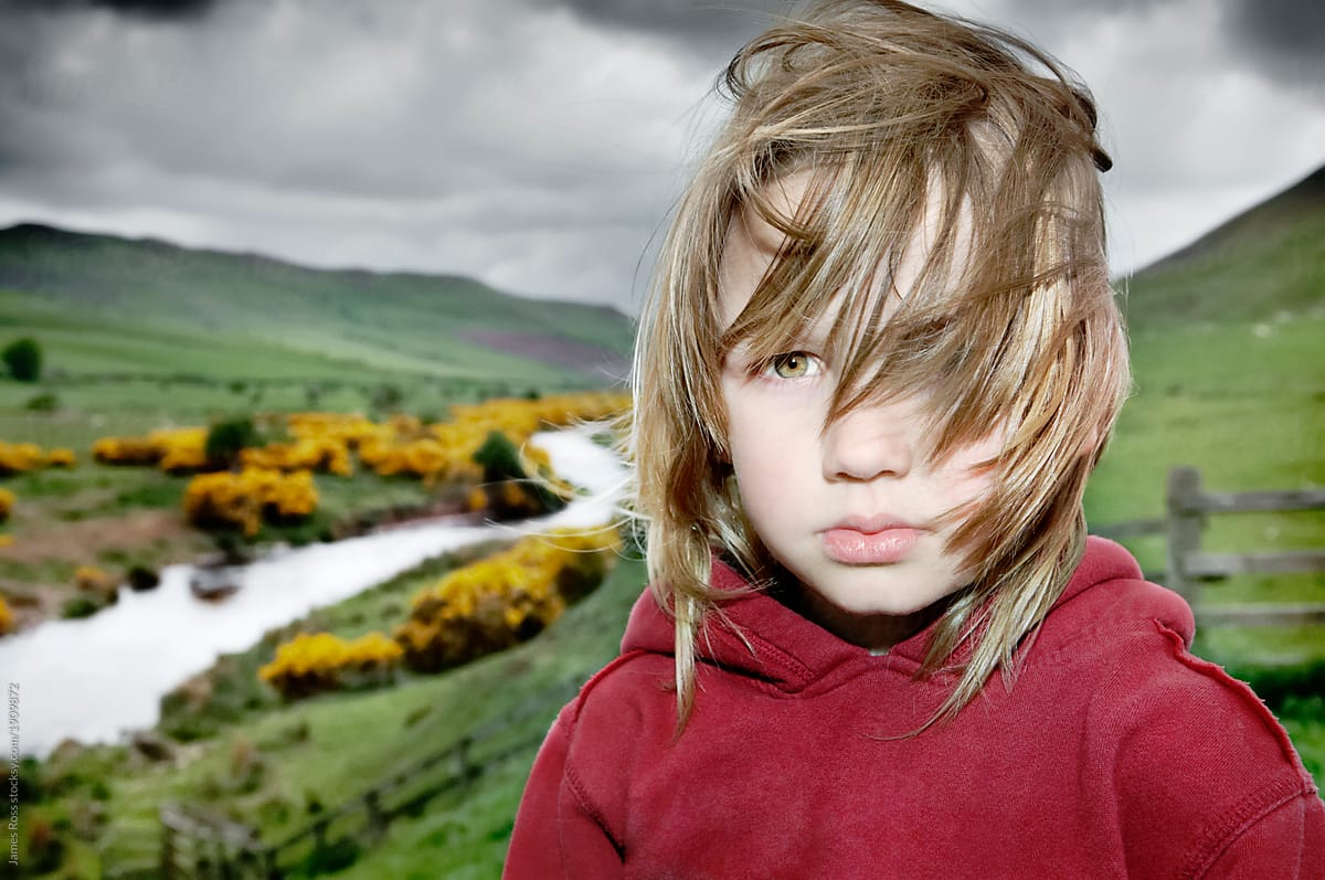 "Boy In Rural Landscape" by Stocksy Contributor "James Ross" - Stocksy