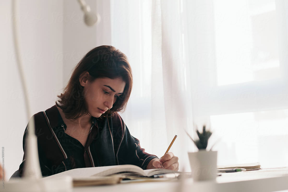 "Young Woman Drawing At Home" by Stocksy Contributor "Lucas Ottone ...