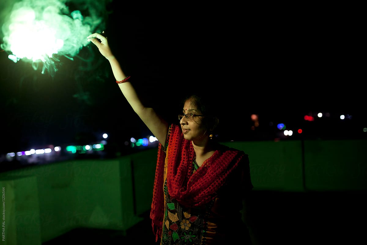 "Indian Woman Making Fun With Firecrackers" by Stocksy Contributor ...
