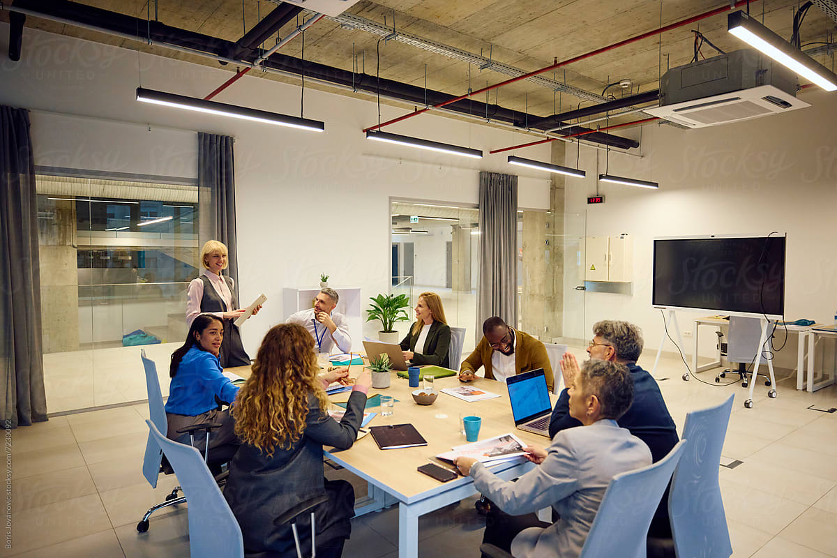 "Workgroup On A Meeting" by Stocksy Contributor "Boris Jovanovic" - Stocksy