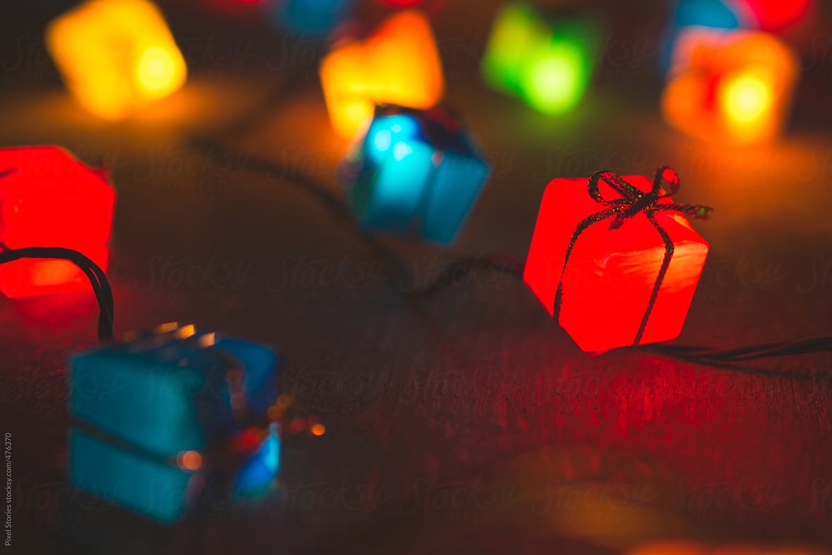 "Gift-shaped Christmas Lights Macro" by Stocksy Contributor "Sibila and ...