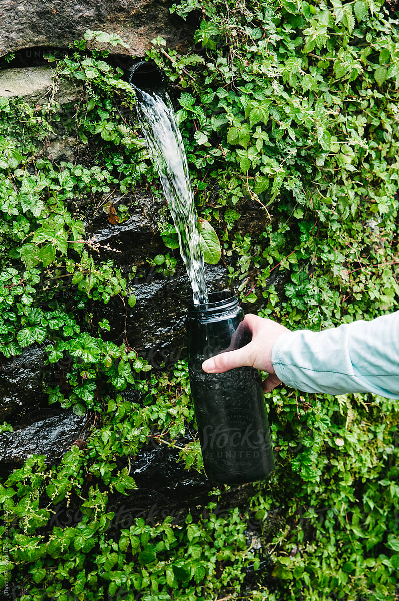 "Trekker Fillingup A Water Bottle, Nepal." by Stocksy Contributor ...