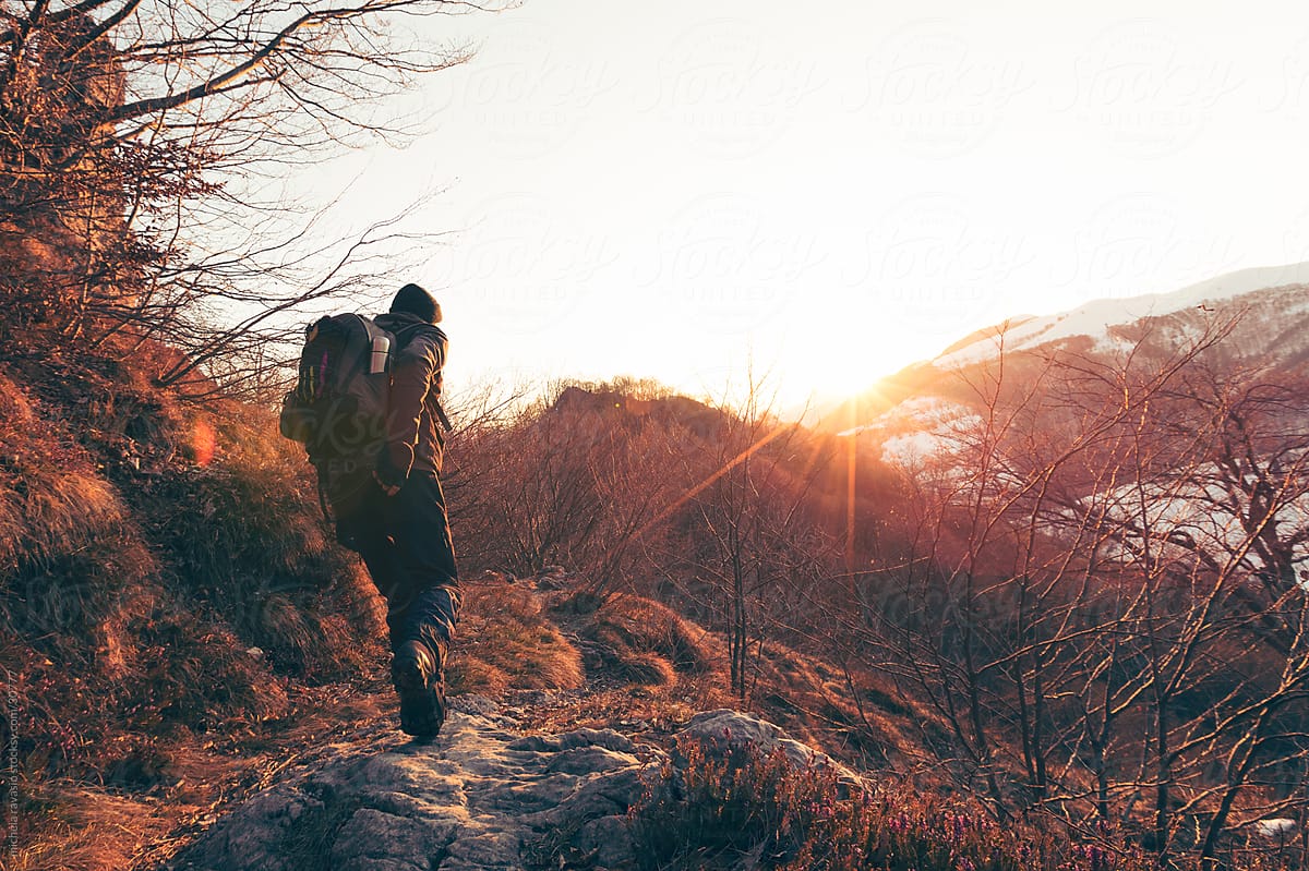 "Hiker Along A Mountain Path At Sunset" by Stocksy Contributor "Michela ...