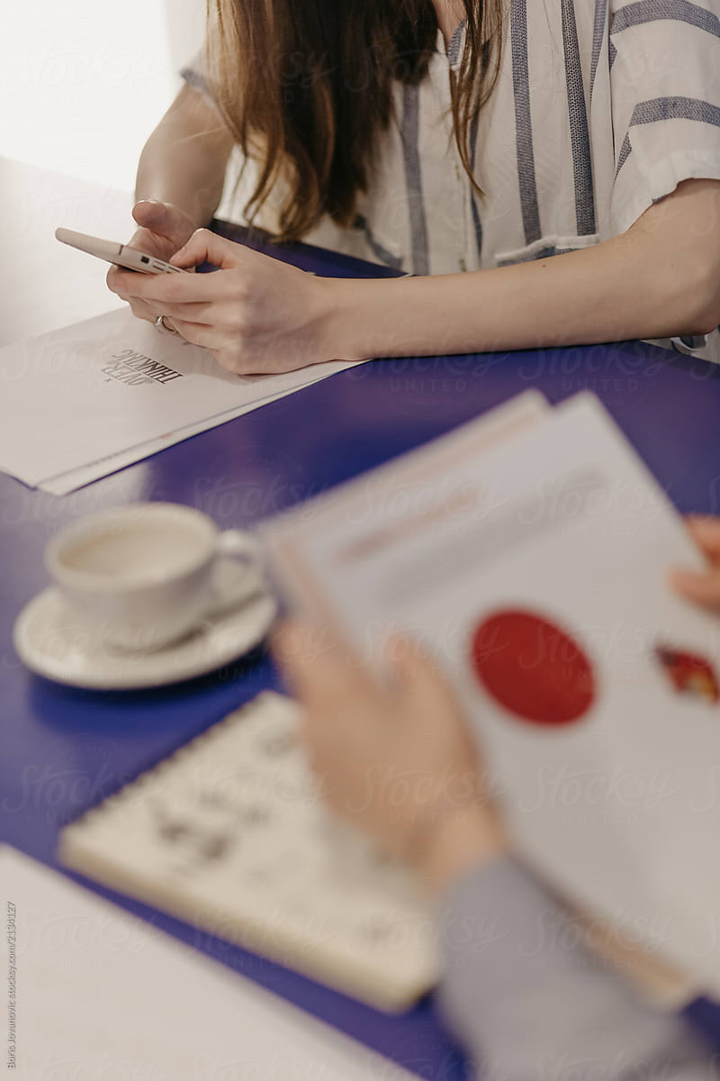 "A Woman Using A Mobile Phone In The Office" by Stocksy Contributor ...