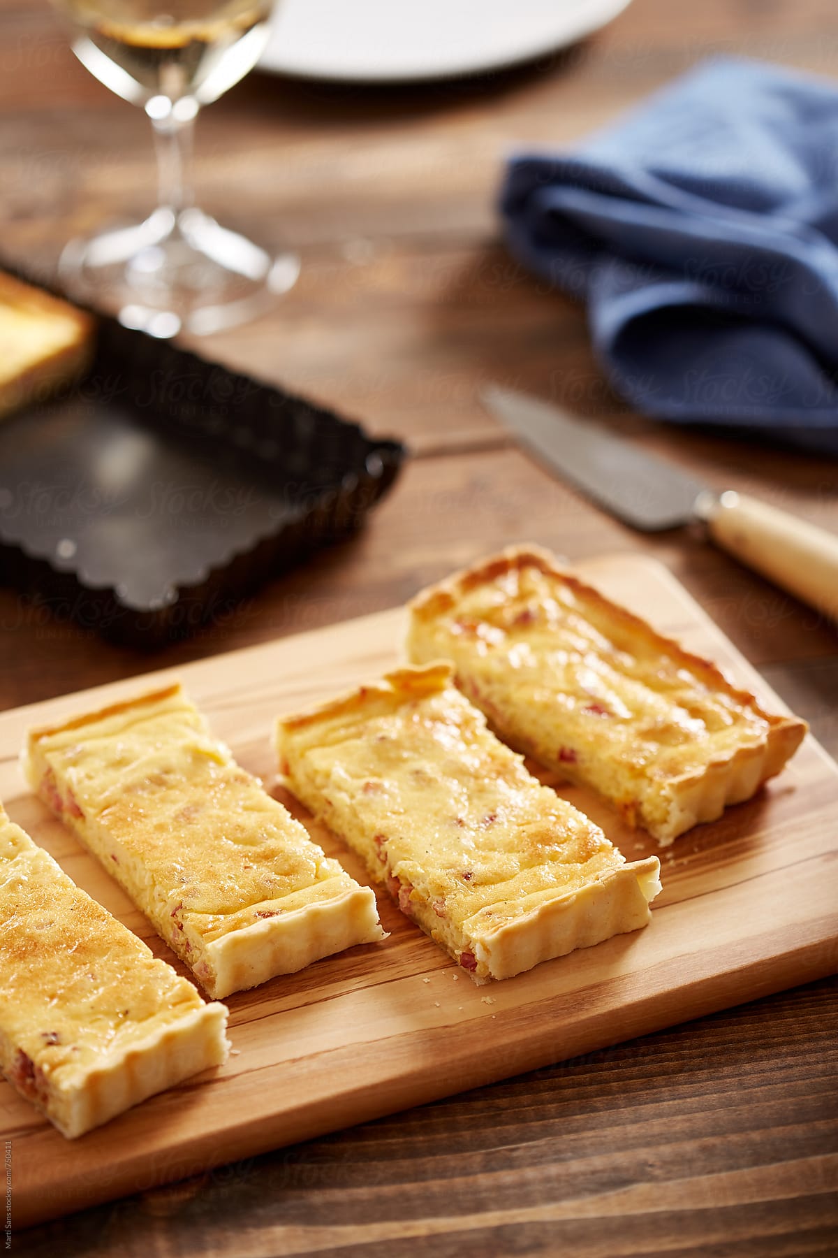"Portions Of Quiche Lorraine On Wooden Board" by Stocksy Contributor ...