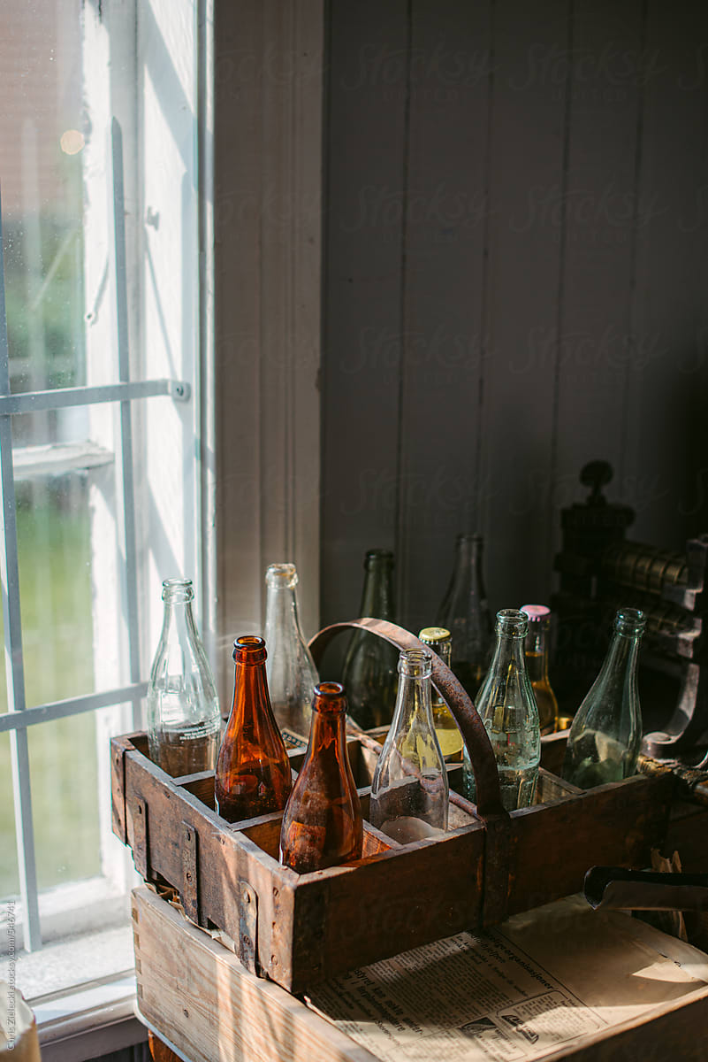 "Old Glass Bottles In Container" by Stocksy Contributor "Chris Zielecki ...