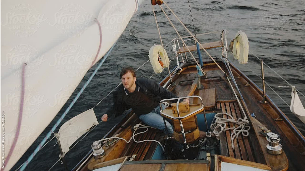 "Adult Man Sailing On Boat" by Stocksy Contributor "Sergey Narevskih ...