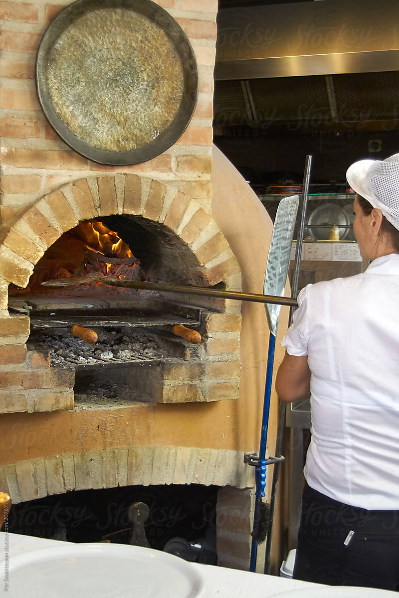 "Pizza Baker" by Stocksy Contributor "PER Images" - Stocksy